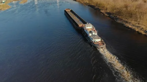 Ship tug with an empty barge floating on... | Stock Video | Pond5
