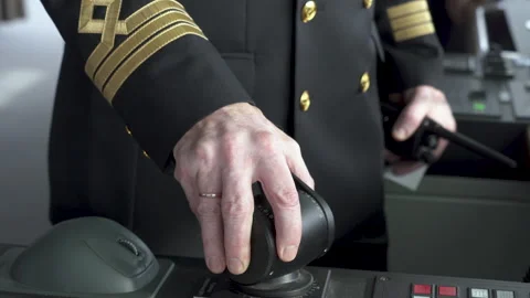 Ship's bridge. Officer turns thruster co... | Stock Video | Pond5