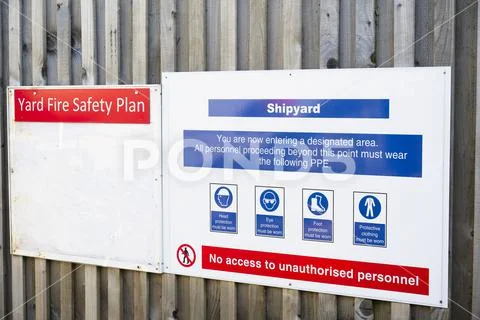 Shipyard health and safety message rules sign board signage on fence ...
