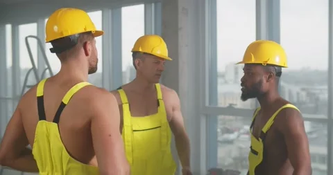 Shirtless diverse builders at constructi... | Stock Video | Pond5