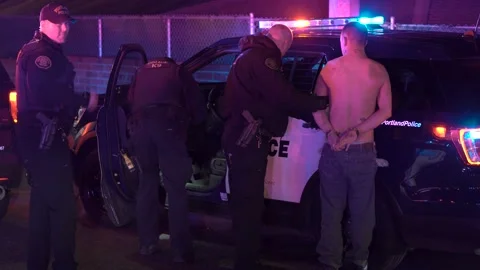 shirtless guy under arrest | Stock Video | Pond5