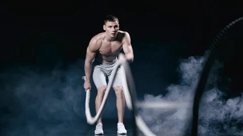 shirtless man exercising with battle rop... | Stock Video | Pond5