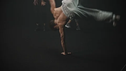 A shirtless man performing breakdancing ... | Stock Video | Pond5