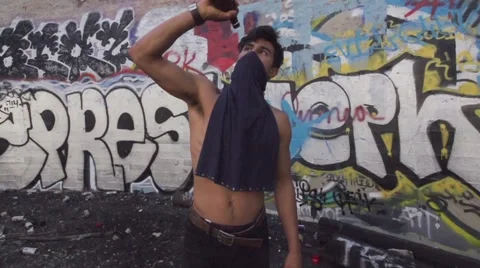 Shirtless man Throws and Shatters Glass ... | Stock Video | Pond5