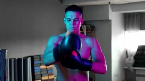 Shirtless young man boxer putting boxer ... | Stock Video | Pond5