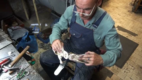 the shoemaker at work.The process of rep... | Stock Video | Pond5