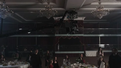 Shooting actors at table with camera on ... | Stock Video | Pond5