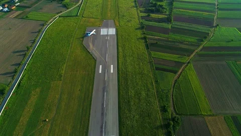 shooting drone to the plane on the runwa... | Stock Video | Pond5