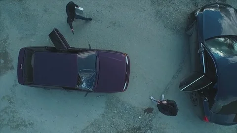 Shoots a gun in the car aerial view. Att... | Stock Video | Pond5