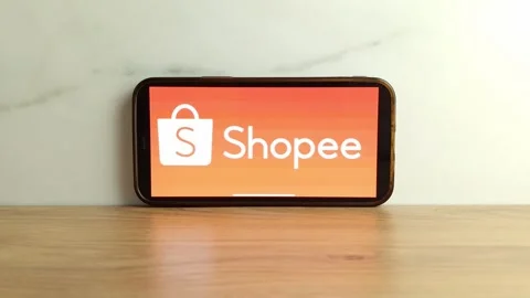 Shopee logo displayed on mobile phone | Stock Video | Pond5