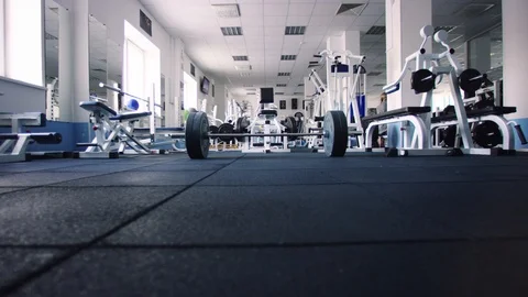 Shot of a barbell in a gym, adult bodybu... | Stock Video | Pond5