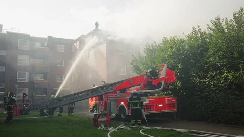 Shot of fire in a roof truss and firefig... | Stock Video | Pond5