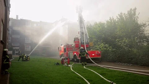 Shot of fire in a roof truss and firefig... | Stock Video | Pond5