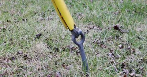 Shot of a moving ground guy wire anchor ... | Stock Video | Pond5