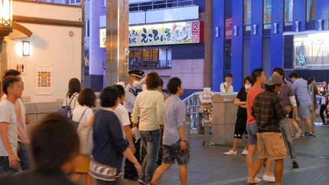 Shot of a police man at Dōtonbori Glico... | Stock Video | Pond5