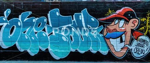 Shot of social graffiti street art mural of alt Mario with red hat and blue ~ Premium Photo ...