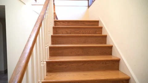 Shot of wooden stairs in an elegant hous... | Stock Video | Pond5