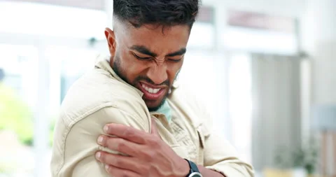 Shoulder pain, injury and face of man wi... | Stock Video | Pond5