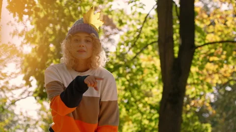 Shushing pose wearing autumn wear clothi... | Stock Video | Pond5