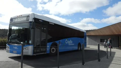 Shuttle bus drives around turning circle... | Stock Video | Pond5
