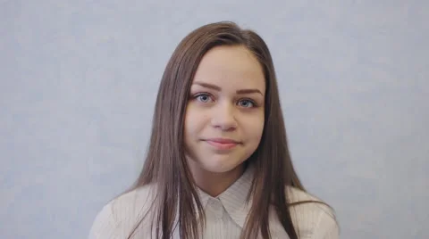 shy, cute girl is shy and embarrassed | Stock Video | Pond5