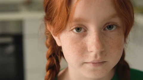 Shy red haired girl 7 years old looking ... | Stock Video | Pond5