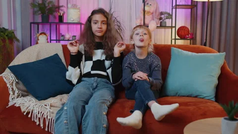 Siblings girls making playful silly faci... | Stock Video | Pond5