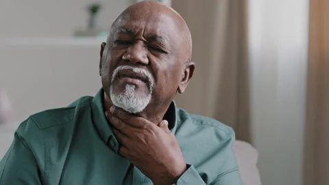 Sick African old man suffer from sore th... | Stock Video | Pond5
