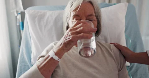 Sick, care and woman drinking water in a... | Stock Video | Pond5
