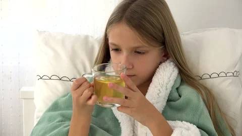 Sick Child Drinking Tea, Ill Kid in Bed,... | Stock Video | Pond5
