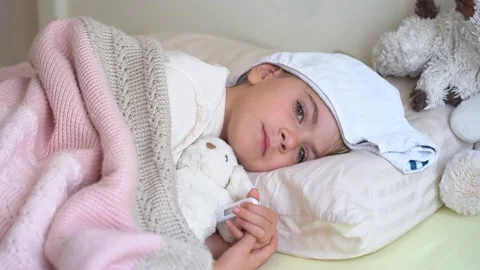 Sick fever cough child lying in bed with... | Stock Video | Pond5
