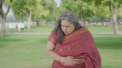 Sick Indian old woman suffering from sto... | Stock Video | Pond5