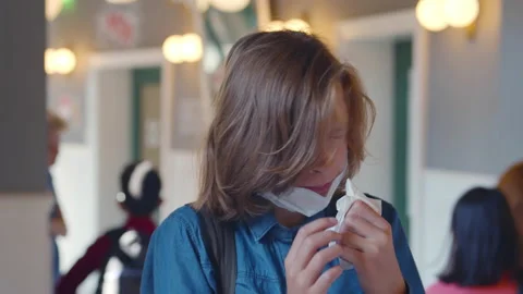 Sick teen boy in safety mask cough in sc... | Stock Video | Pond5