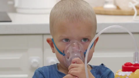 Sick toddler child doing inhalation at h... | Stock Video | Pond5