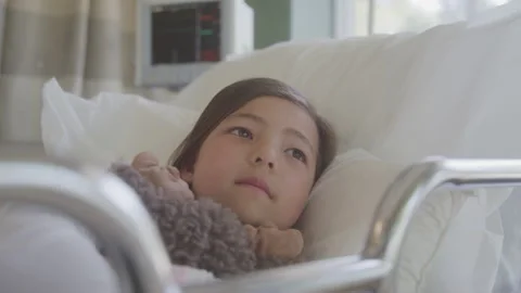Sick Young Girl In Hospital Bed | Stock Video | Pond5