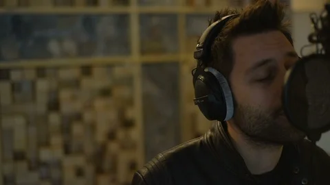 side camera movement of singer singing i... | Stock Video | Pond5