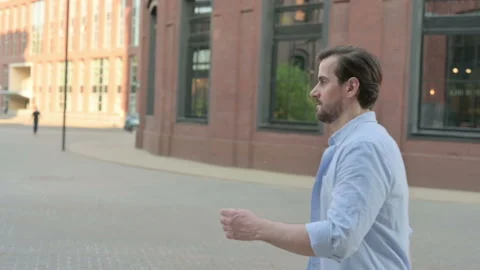 Side Pose of Man Walking in a Street in ... | Stock Video | Pond5