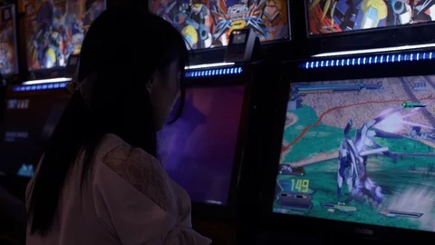 Side Profile Of Asian Female Playing Vid... | Stock Video | Pond5
