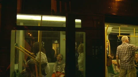 Side profile, people boarding a tram in ... | Stock Video | Pond5