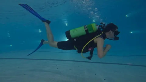 Side profile of scuba diver training in ... | Stock Video | Pond5