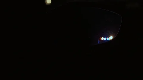 Side rear mirror view of police car chas... | Stock Video | Pond5