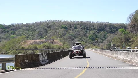 SIDE-BY-SIDE over bridge , UTV Off Road ... | Stock Video | Pond5