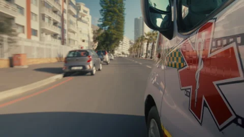 Side view of An ambulance driving fast t... | Stock Video | Pond5