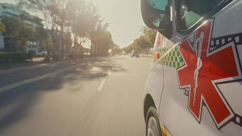 Side view of An ambulance driving fast o... | Stock Video | Pond5