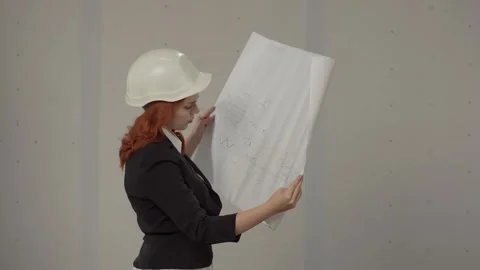 Side view of an architect woman holding ... | Stock Video | Pond5