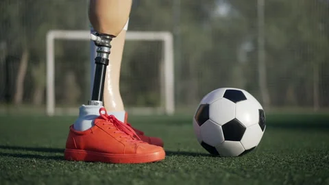 Side view artificial limbs and soccer ba... | Stock Video | Pond5