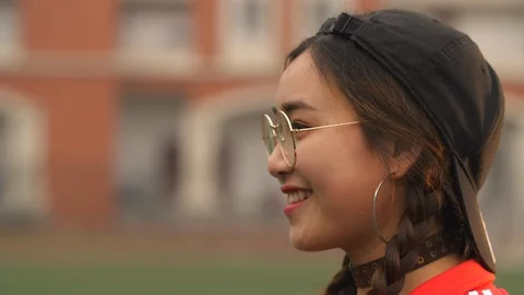 Side view of Asian college girl smile 4k | Stock Video | Pond5