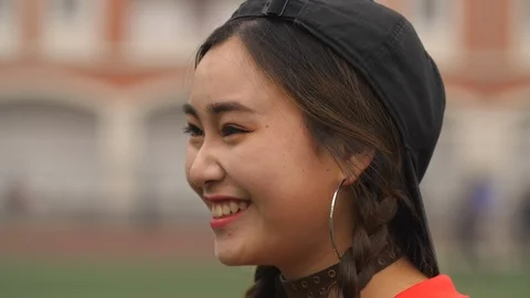 Side view of Asian college girl smile 4k | Stock Video | Pond5