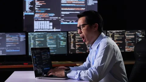 Side View Of Asian Male Programmer Yawni... | Stock Video | Pond5