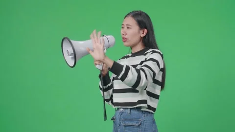 Side View Of Asian Woman Speaking On Meg... | Stock Video | Pond5